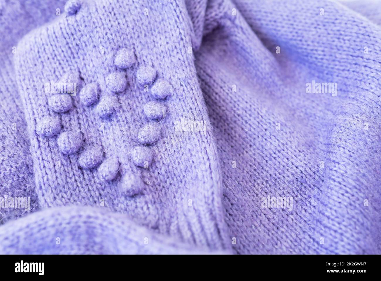Background texture: lavender wool knitted fabric with a heart. Very ...