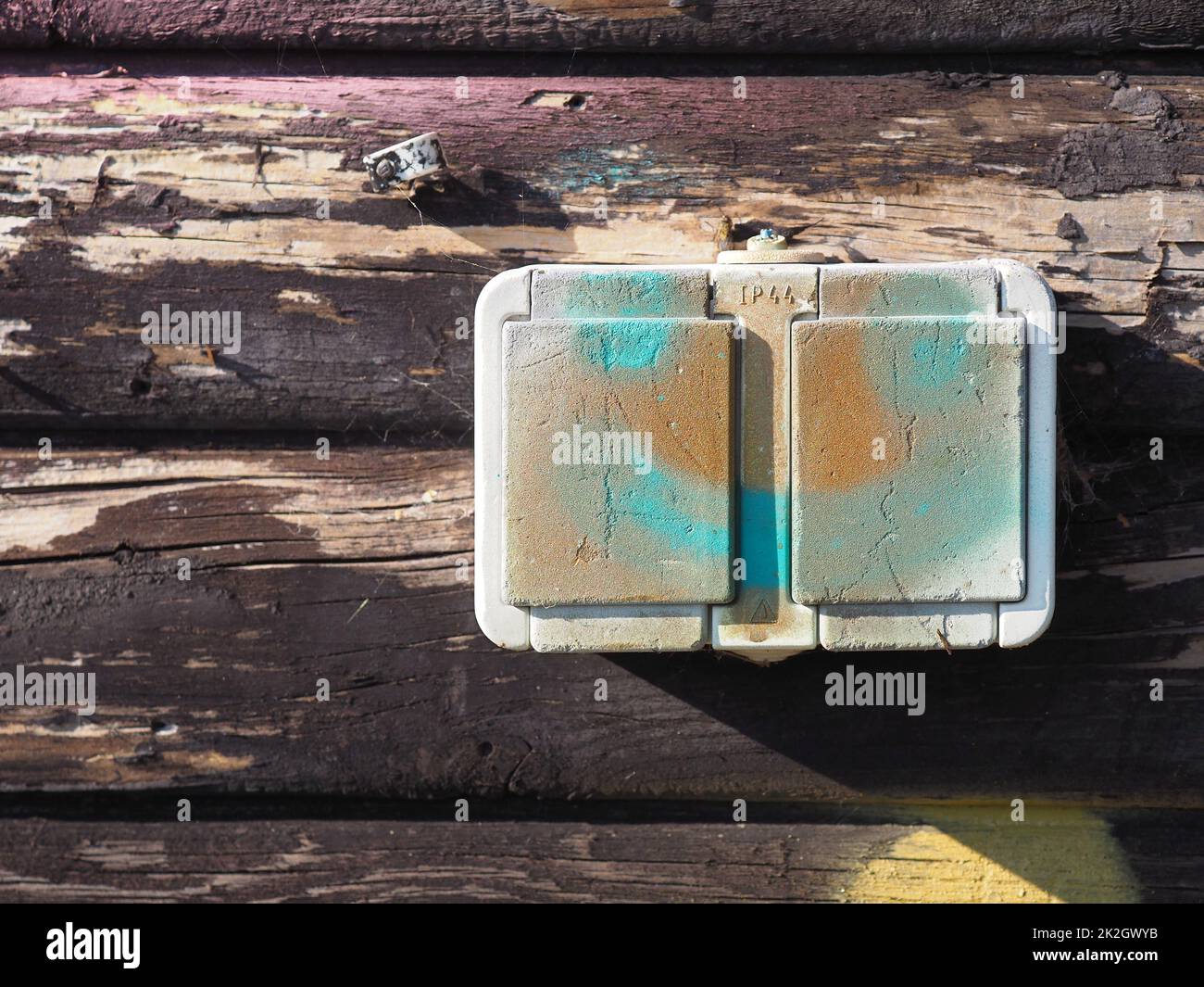 Double socket on wooden wall Stock Photo - Alamy