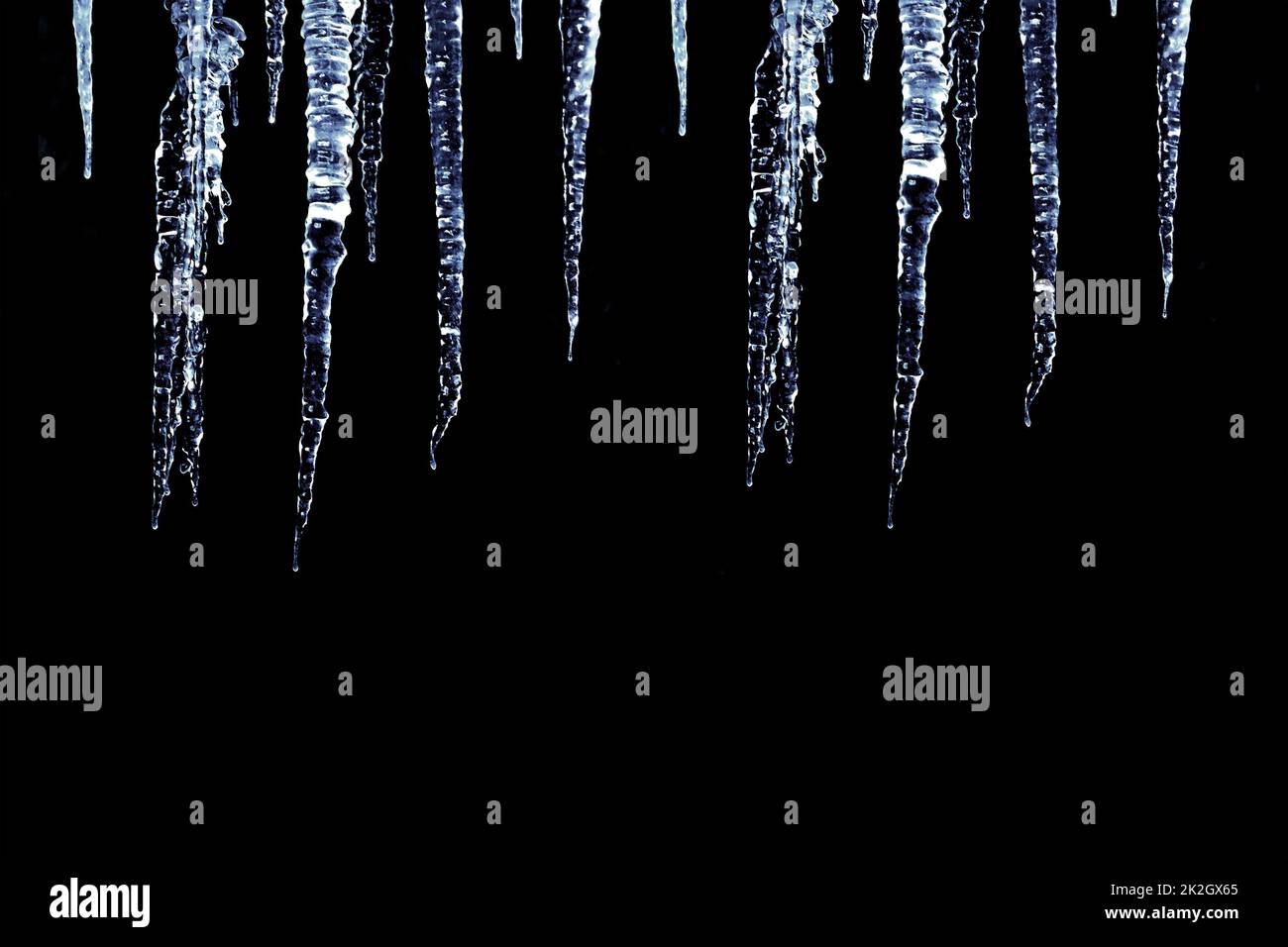 Ice Sticks Over Black Background Stock Photo - Alamy