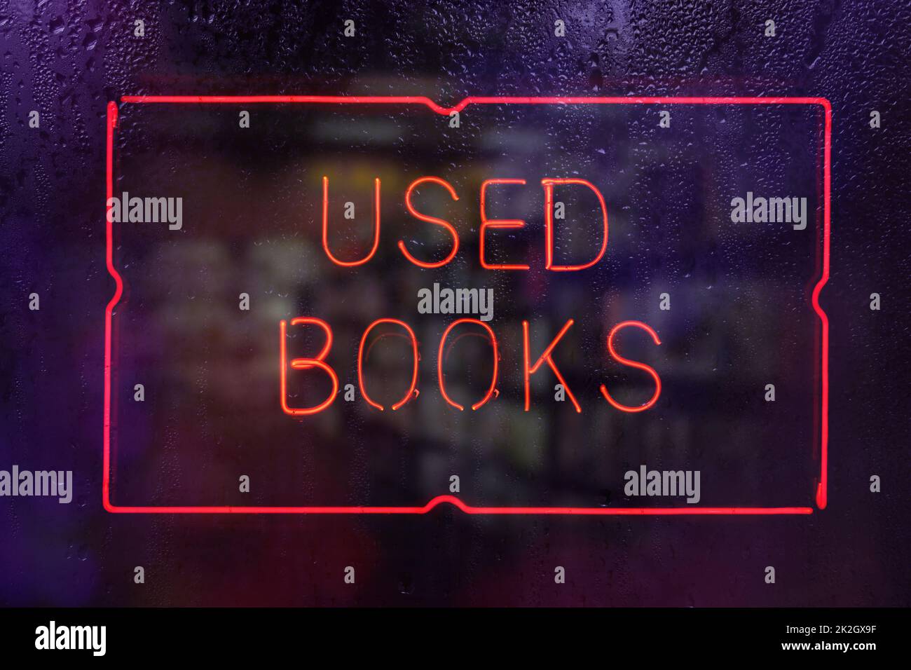 Vintage Neon Used Books Sign in Rainy Window Stock Photo - Alamy