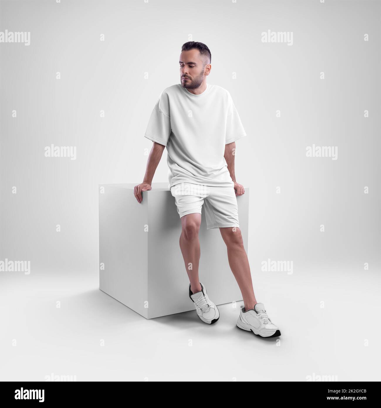 Mockup of a white men's oversized t-shirt with shorts on a man on a ...