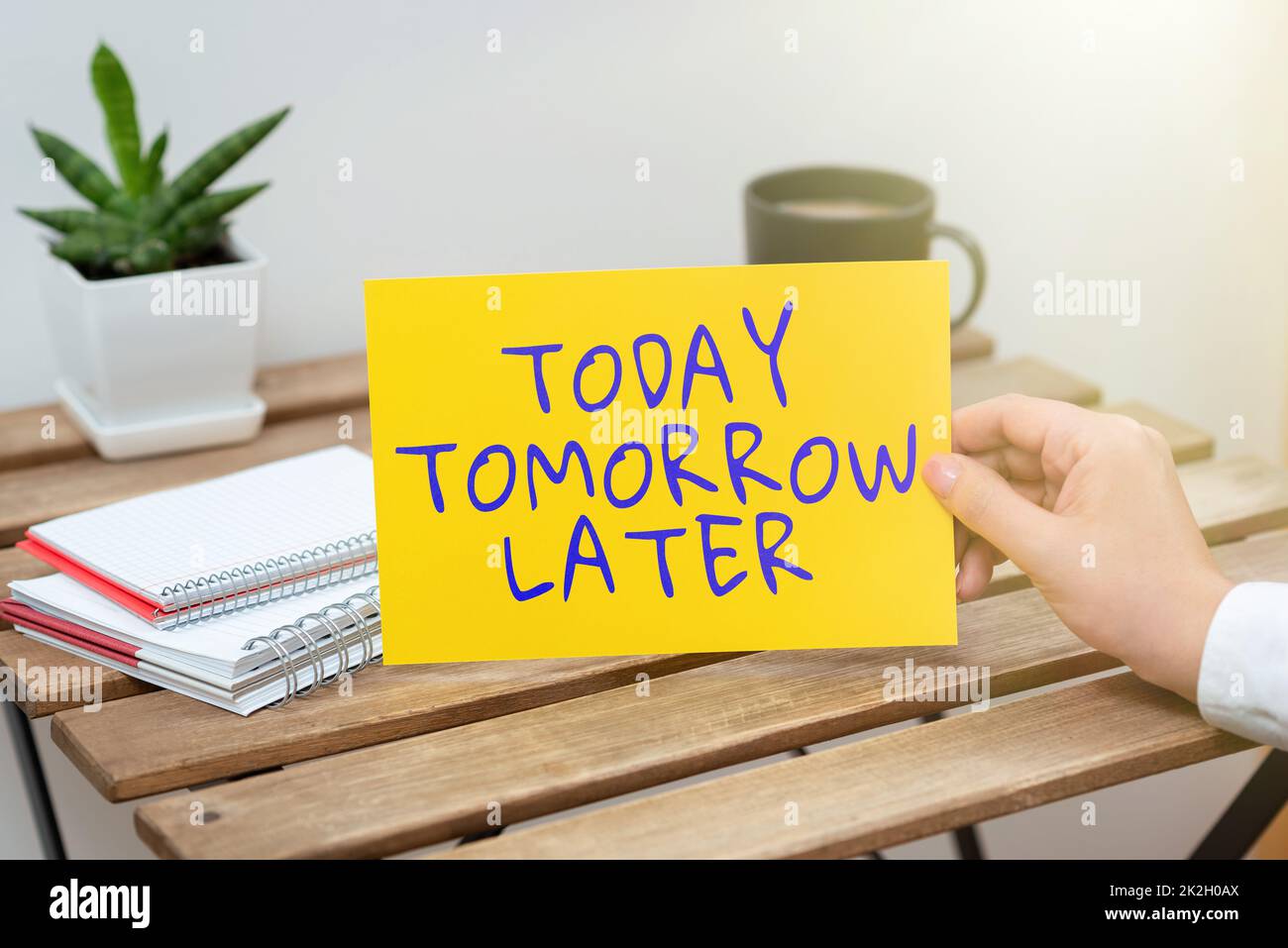 Hand writing sign Today Tomorrow Later. Internet Concept Presently ...