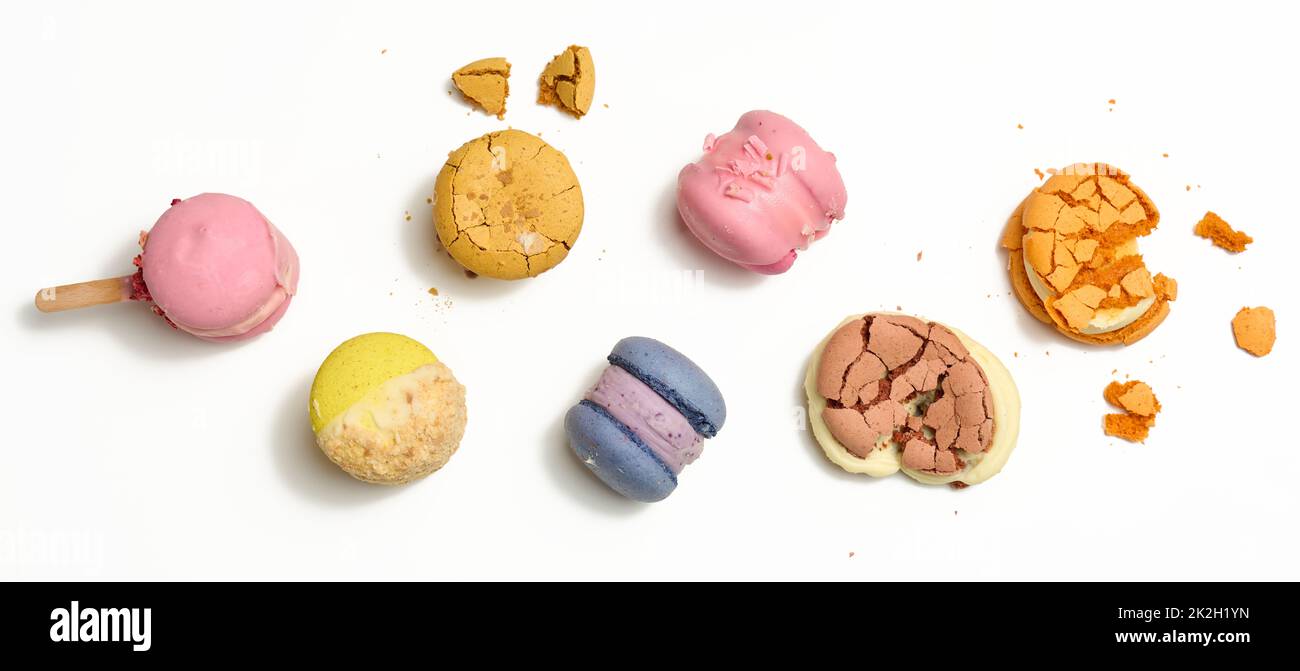 baked macarons with different flavors on a white background, top view ...