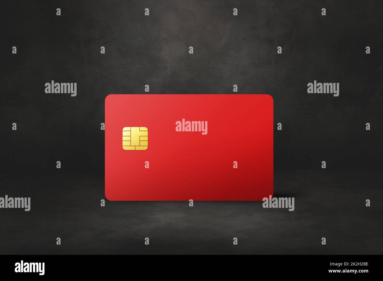Red credit card on a black concrete background Stock Photo - Alamy