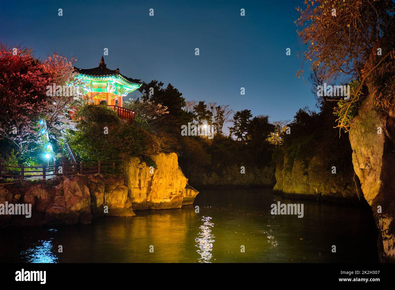 Yongyeon Pond with Yongyeon Pavilion illuminated at night, Jeju islands, South Korea Stock Photo ...