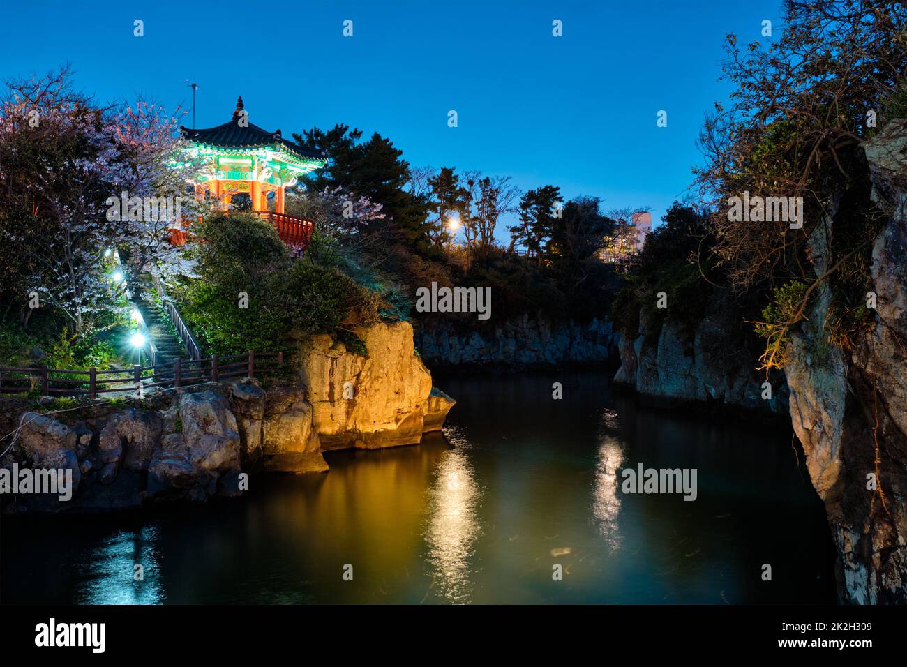 Yongyeon Pond with Yongyeon Pavilion illuminated at night, Jeju islands ...