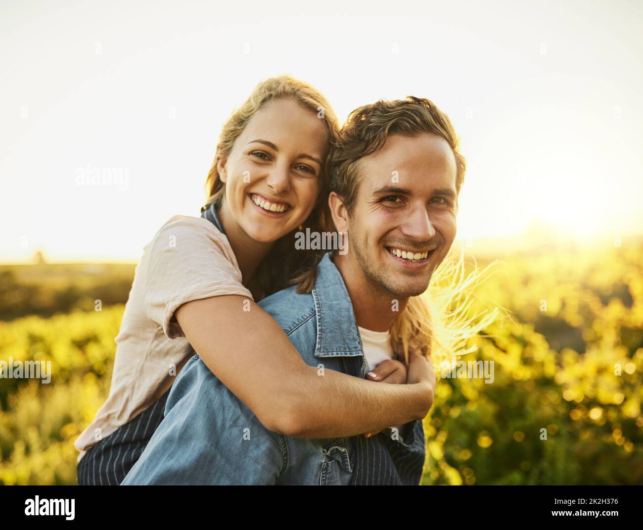We always have fun outside in nature. Shot of a young couple walking ...