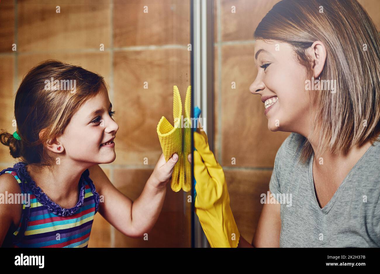 Two women cleaning window together hi-res stock photography and images ...