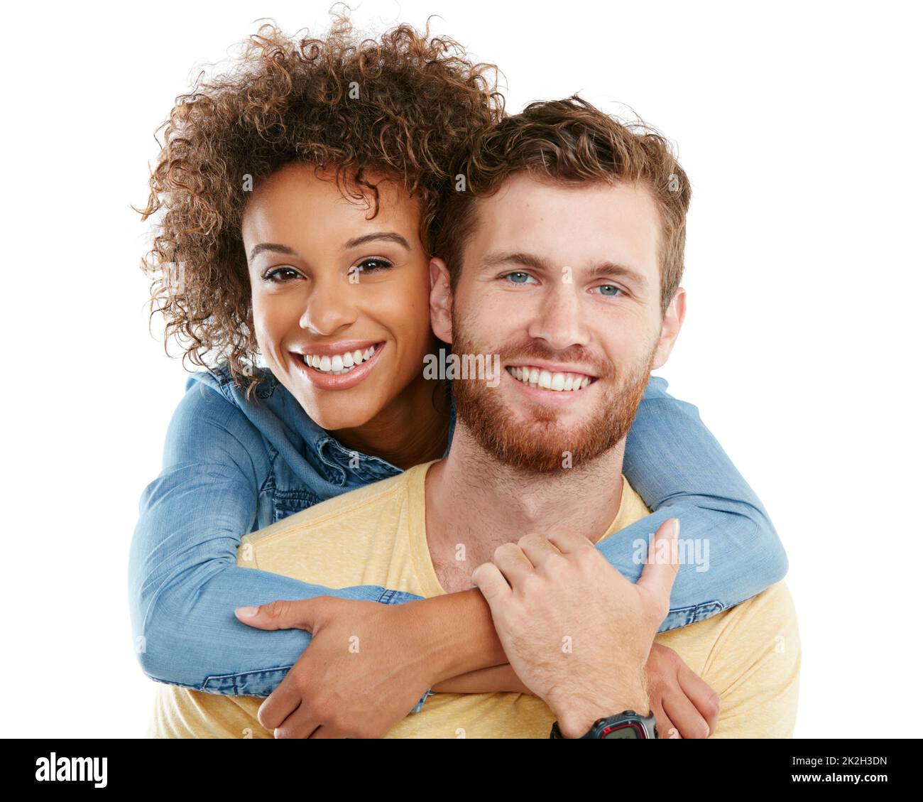 This ones all mine. Studio portrait of an affectionate young woman hugging her boyfriend against ...