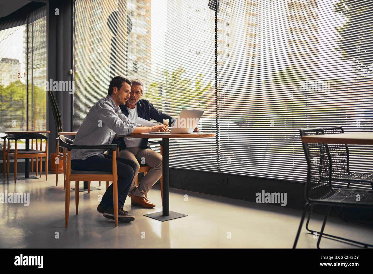 Working hard is what achieves success. Shot of businessmen working ...