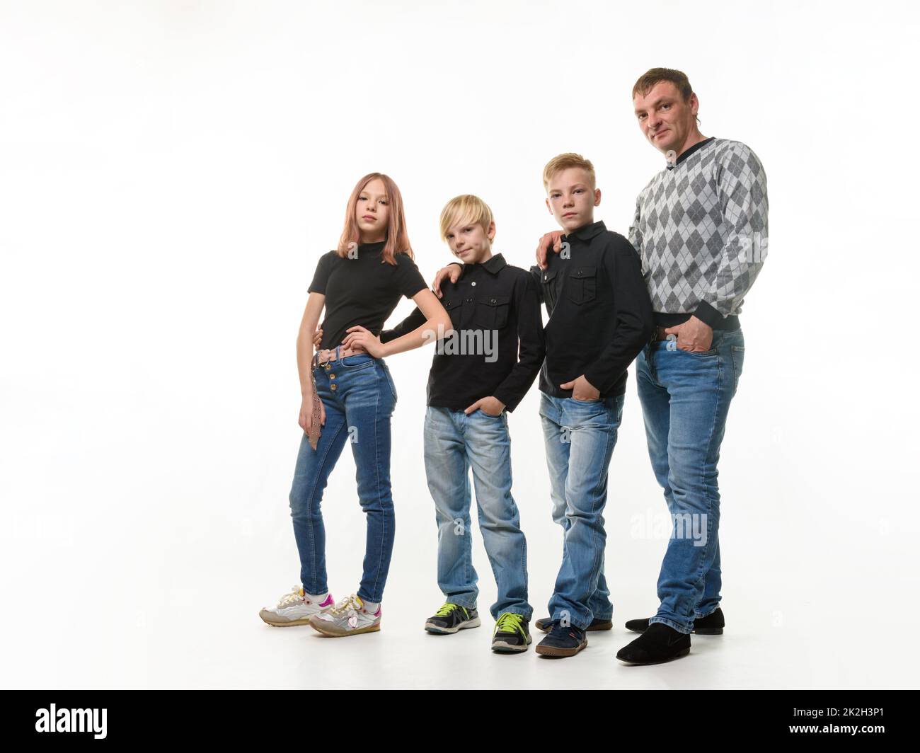 Dad Two Sons And Daughter In Casual Clothes In Dark Colors Full