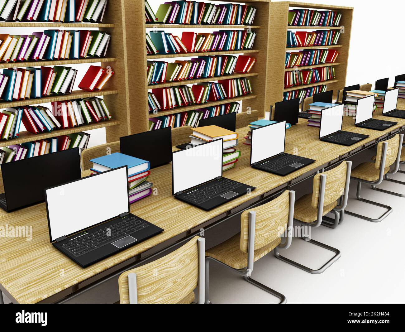 Laptop computers on the table inside a library Stock Photo - Alamy