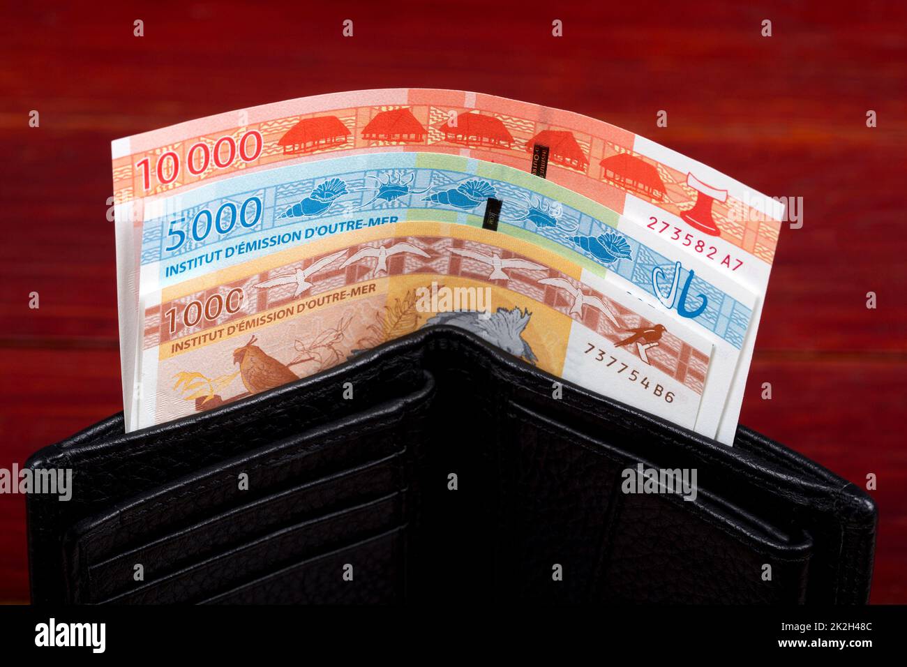 CFP francs in the black wallet Stock Photo - Alamy