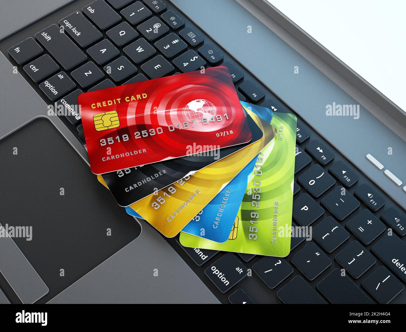 Credit card standing on laptop keyboard Stock Photo - Alamy
