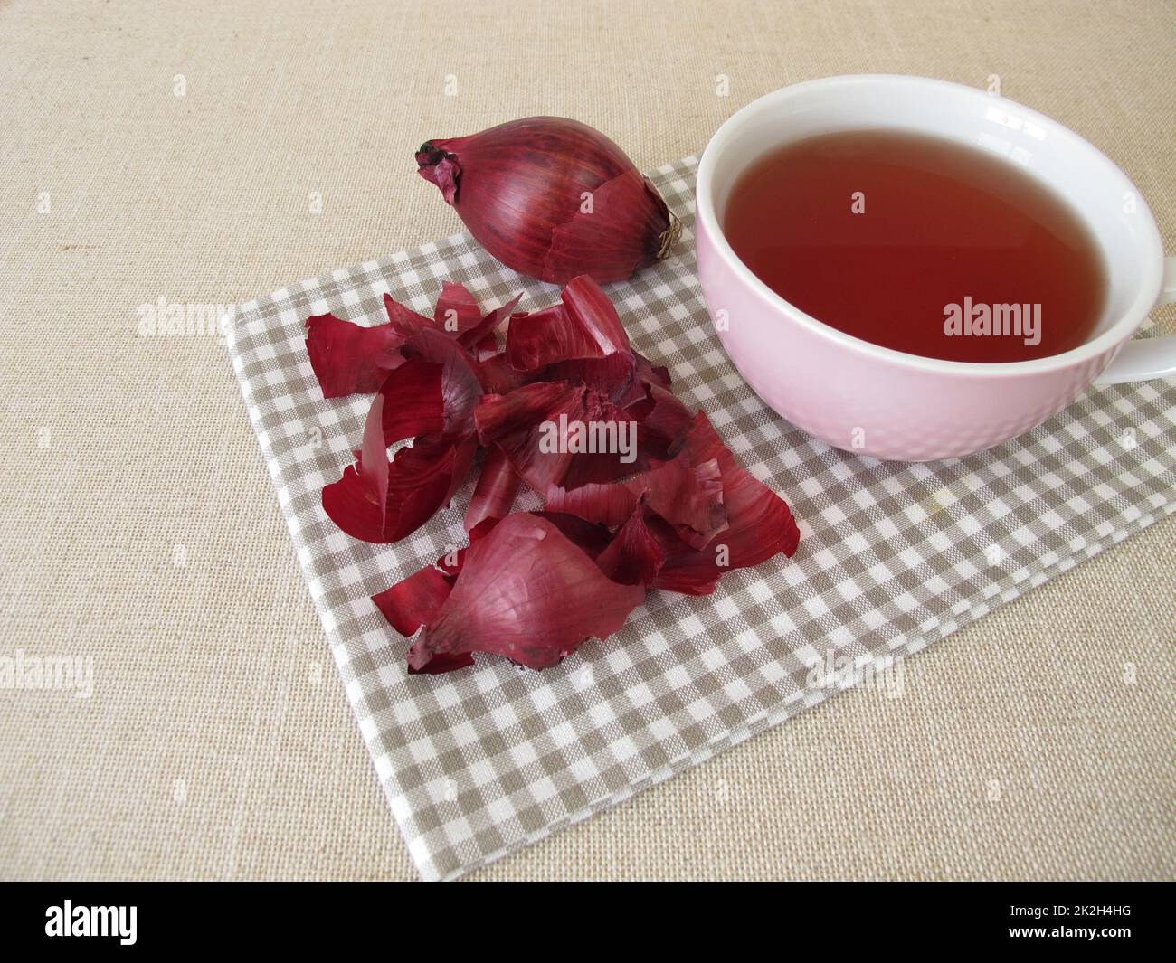 A cup of red onion peel tea Stock Photo - Alamy