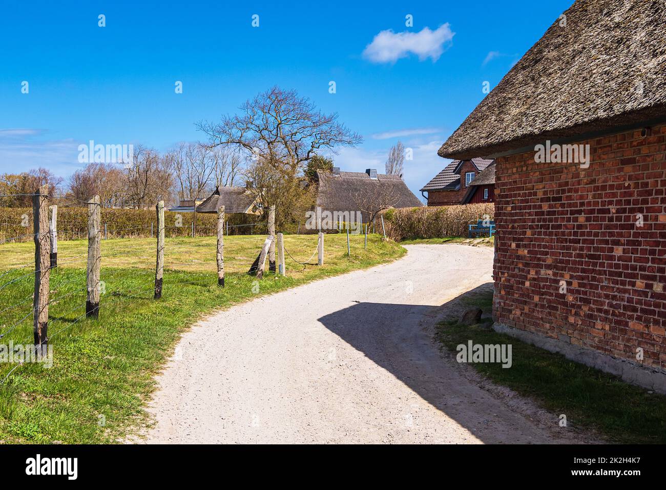 Way with fence and buildings in Ahrenshoop, Germany Stock Photo - Alamy