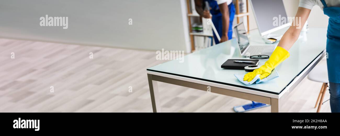 Male And Female Cleaners Cleaning Office Stock Photo - Alamy
