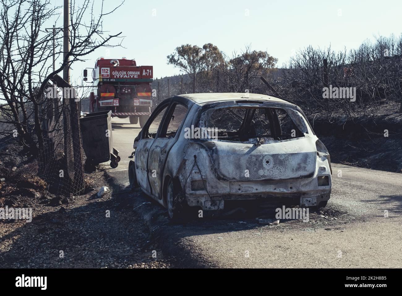 Izmir, Turkey - July 23, 2022: Rear view of Burnt car with a firetruck ...