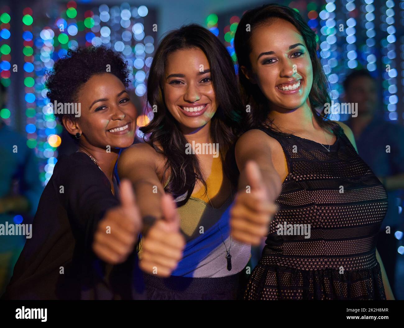 Good times in the club. Portrait of a group of young ladies showing ...