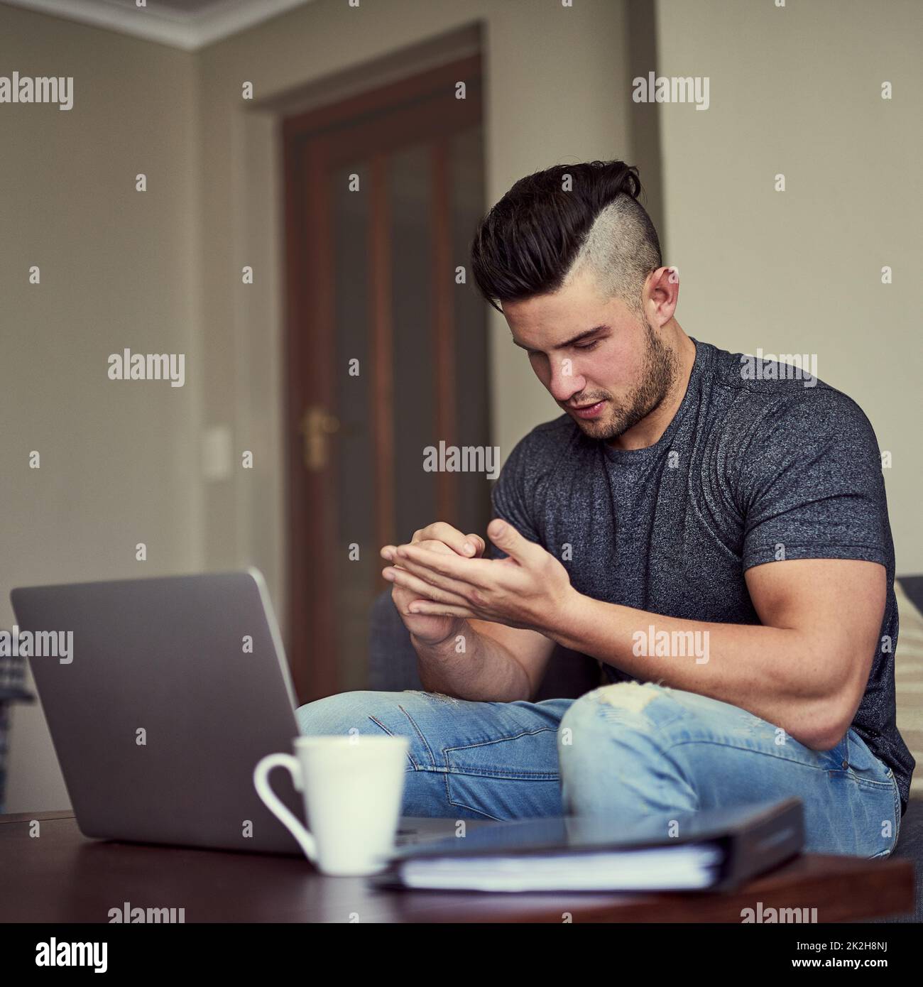 Man on computer making notes hi-res stock photography and images - Alamy