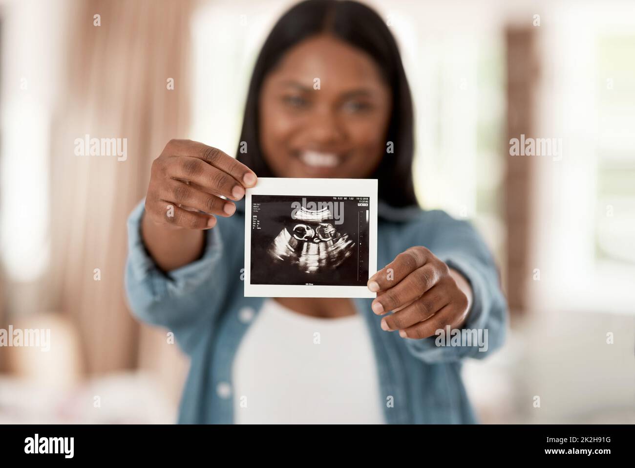 Guess whos joining the family soon. Closeup shot of an unrecognisable ...