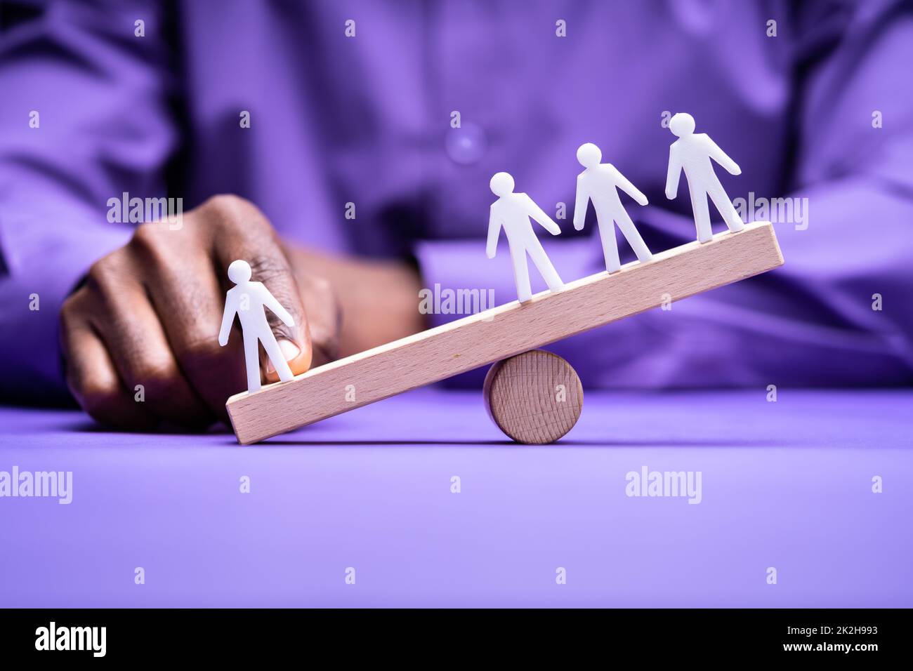 Imbalance seesaw hi-res stock photography and images - Alamy