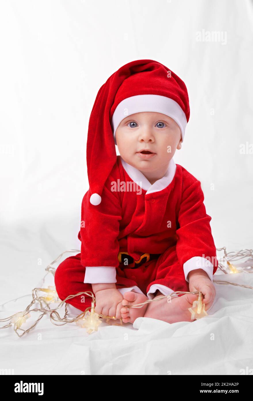 The biggest gift of all. Studio shot of a little boy dressed up in a ...