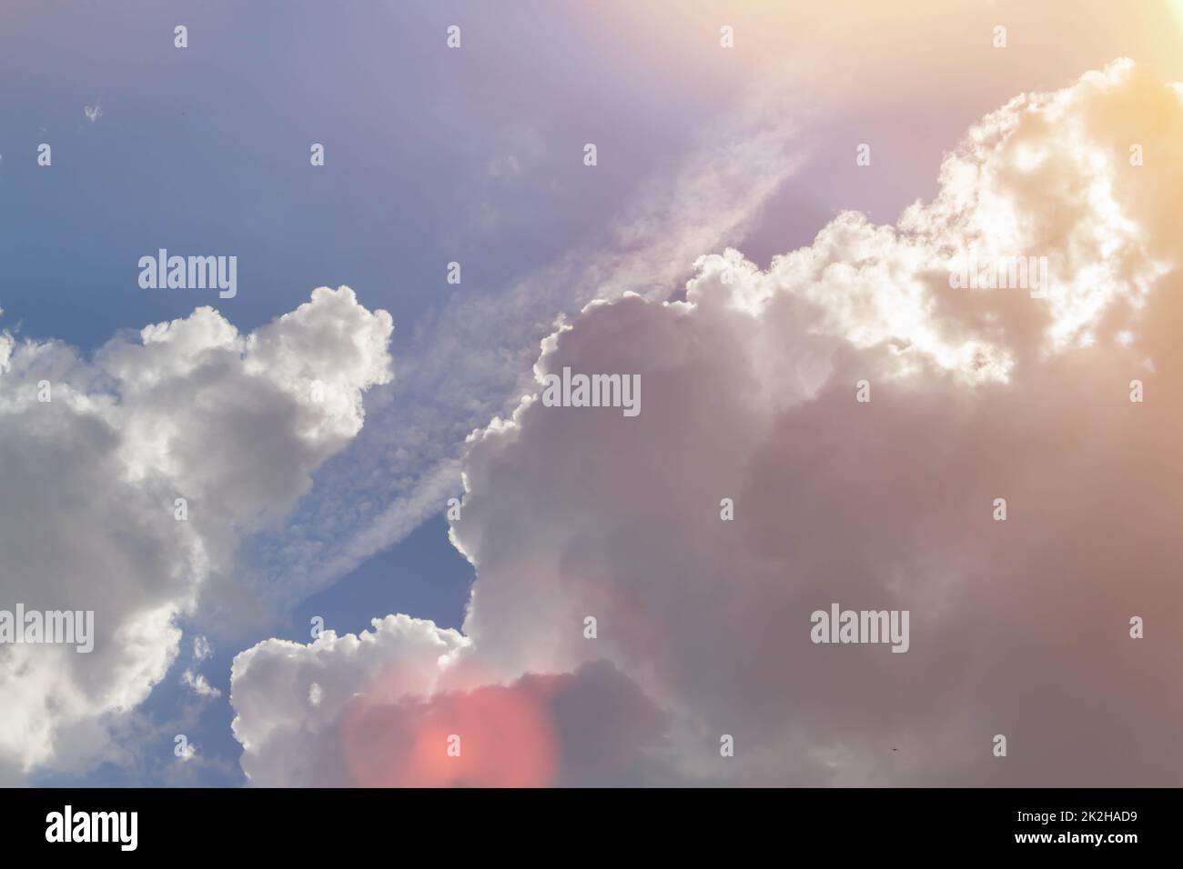 White clouds in bright sunlight. Sunrise. Revival of day. Clouds in ...