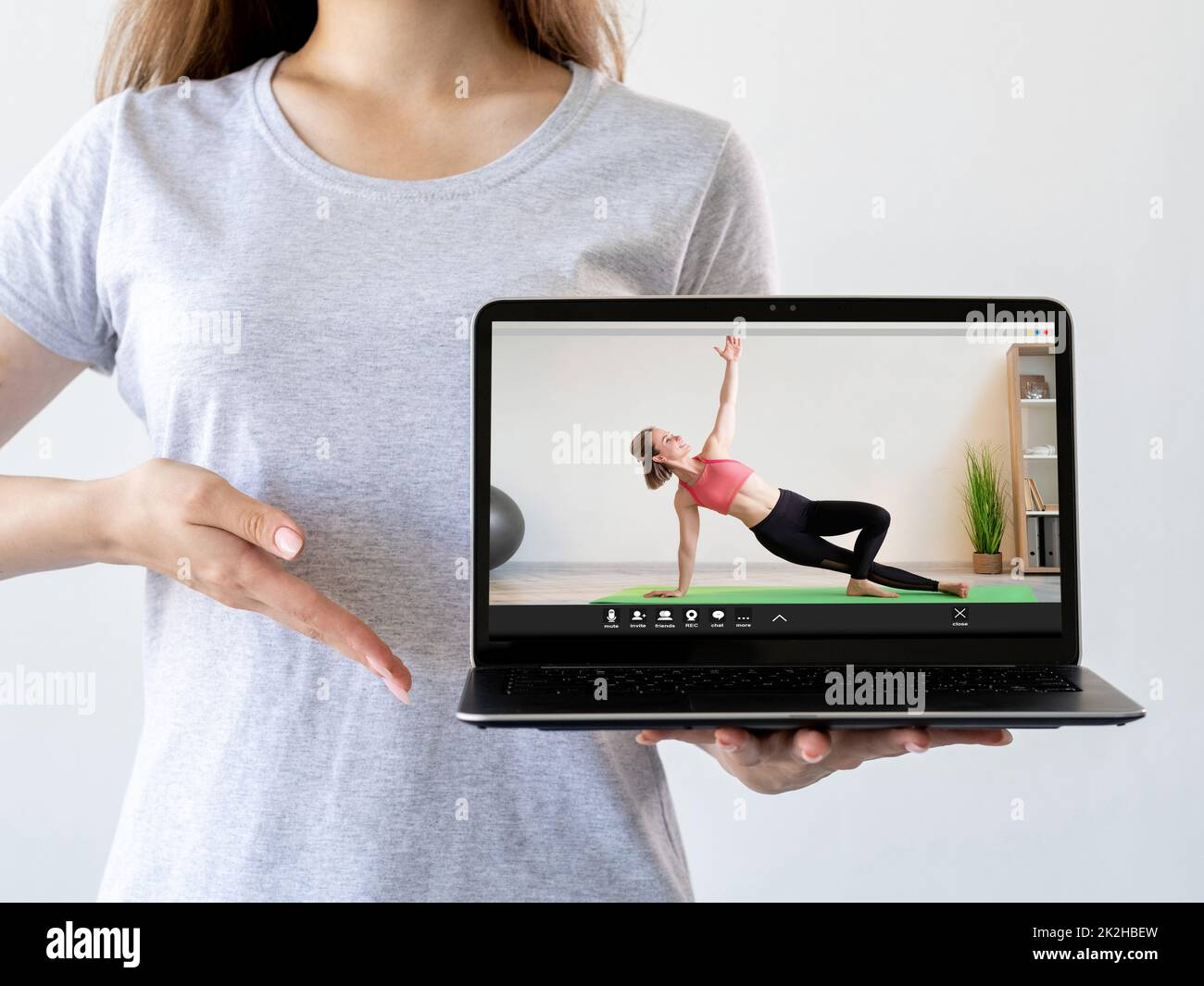 Virtual fitness class. Online training. Pilates tutorial. Woman hand ...