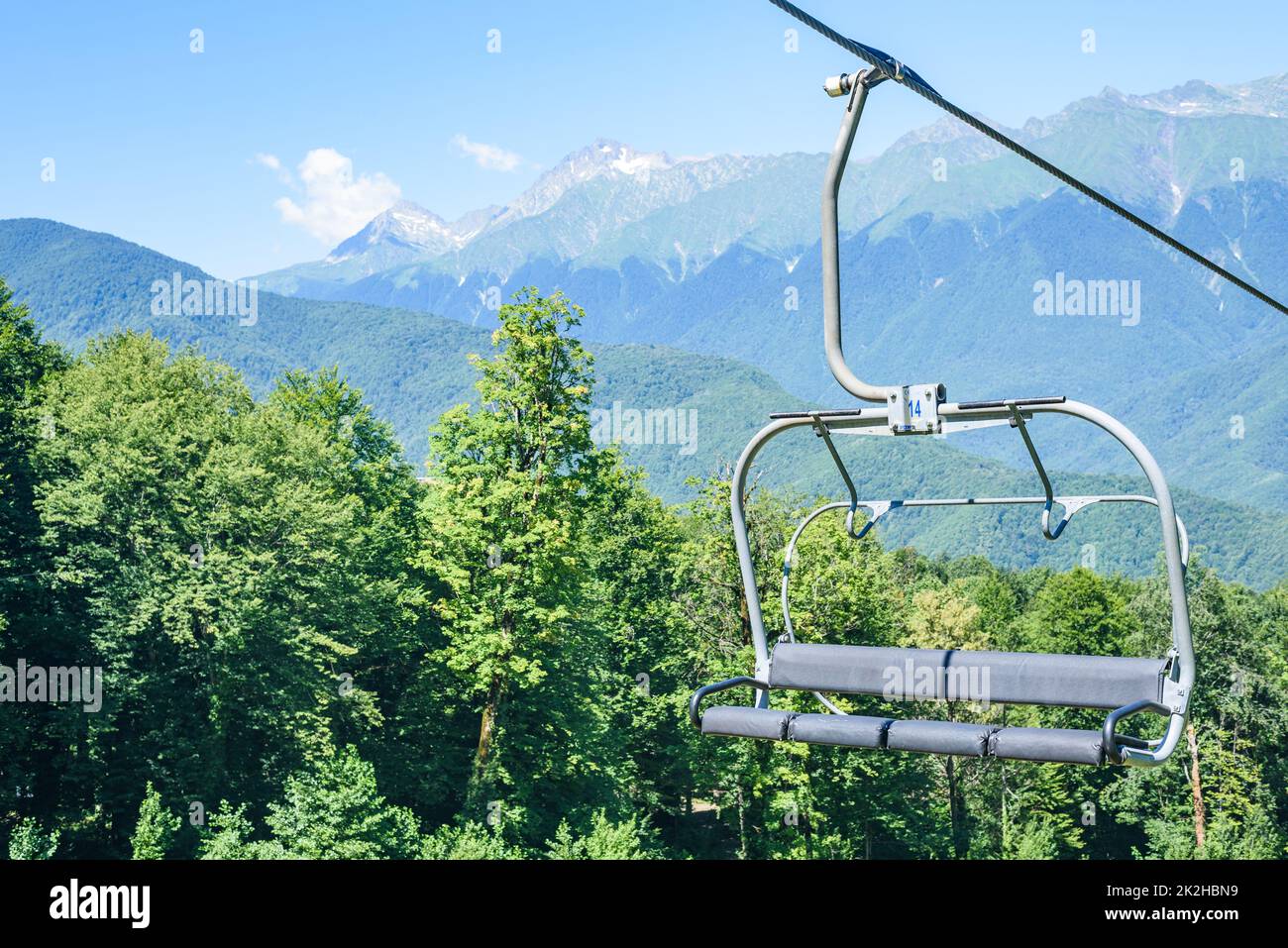 Cable car chair against picturesque mountain landscape Stock Photo - Alamy