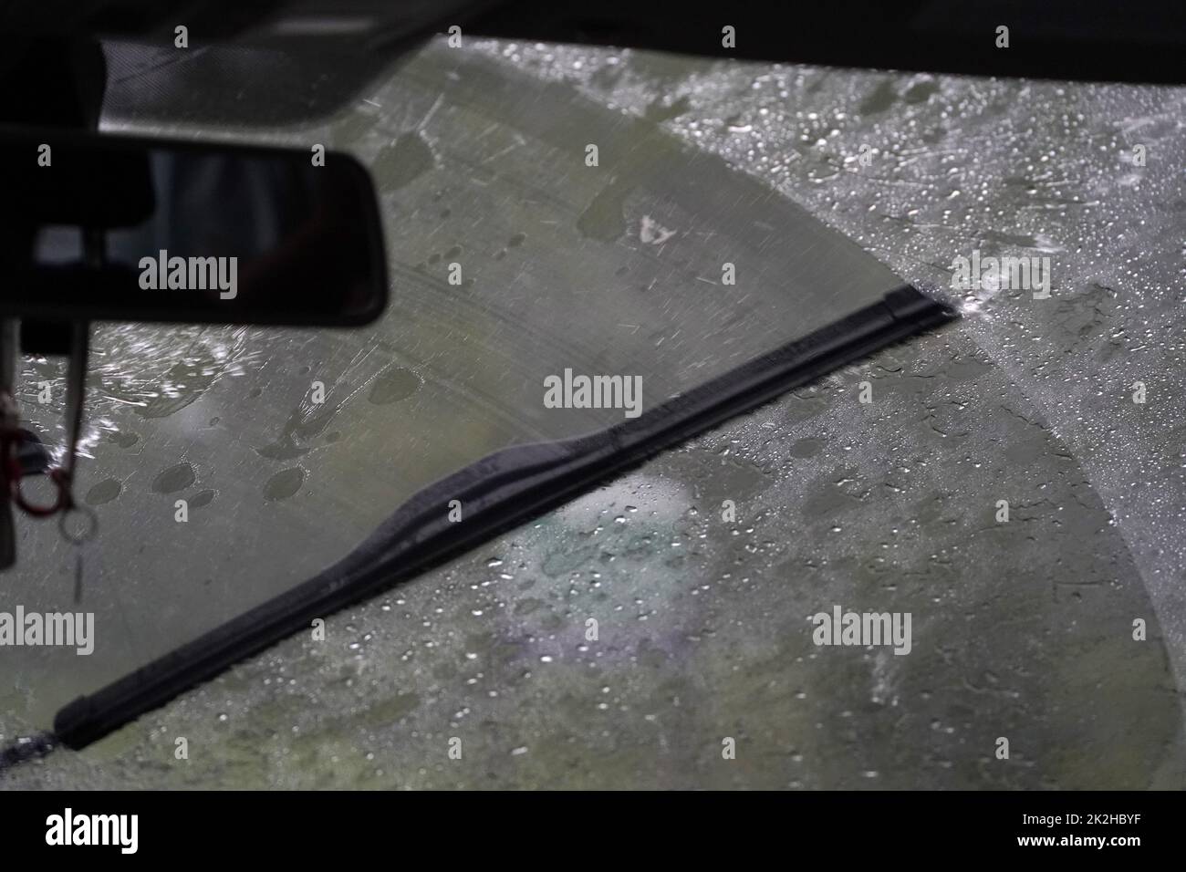 heavy rain on car windscreen wiper detail Stock Photo - Alamy