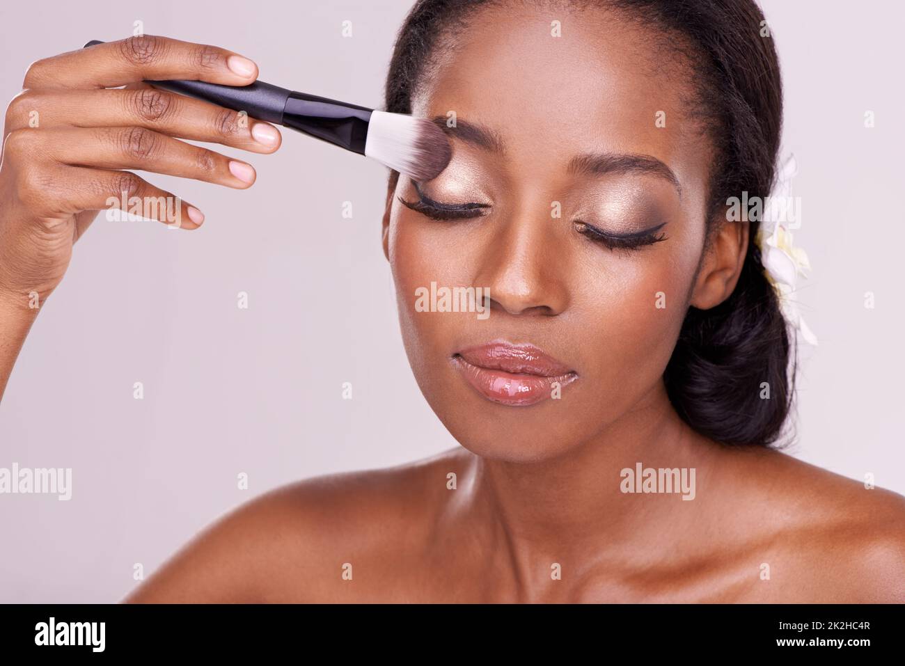 Choose your look. Studio shot of a beautiful young woman with a set of ...