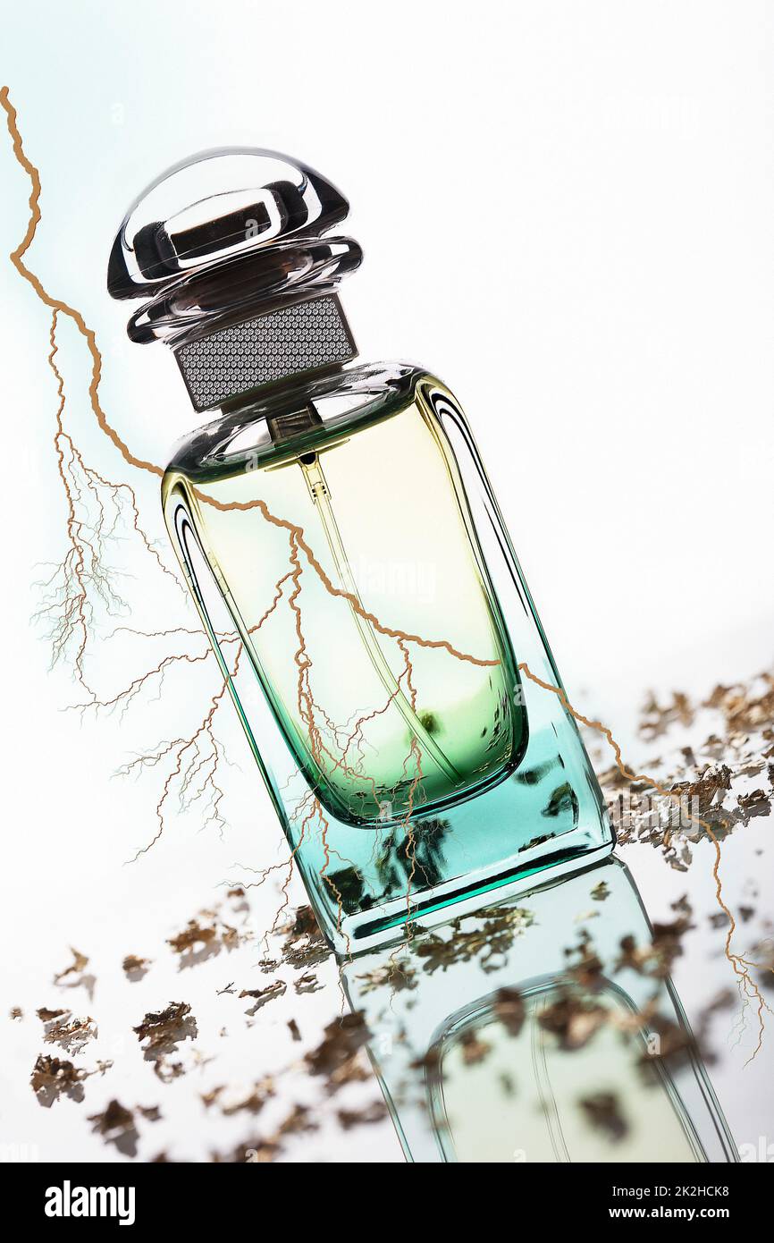 Perfume green with the flash Stock Photo - Alamy