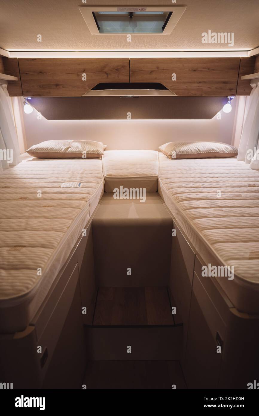 Bed inside a new luxury camper van motorhome Stock Photo - Alamy