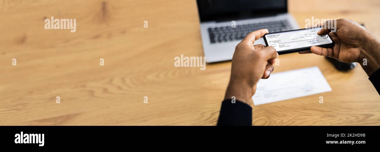 Remote Check Deposit Using Mobile Remote Stock Photo - Alamy