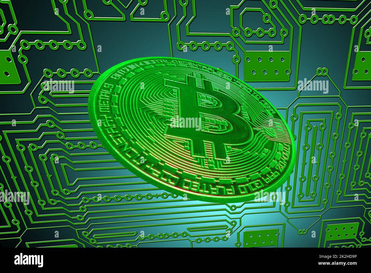 green circuit board and a valueable green bitcoin from crypto currency ...