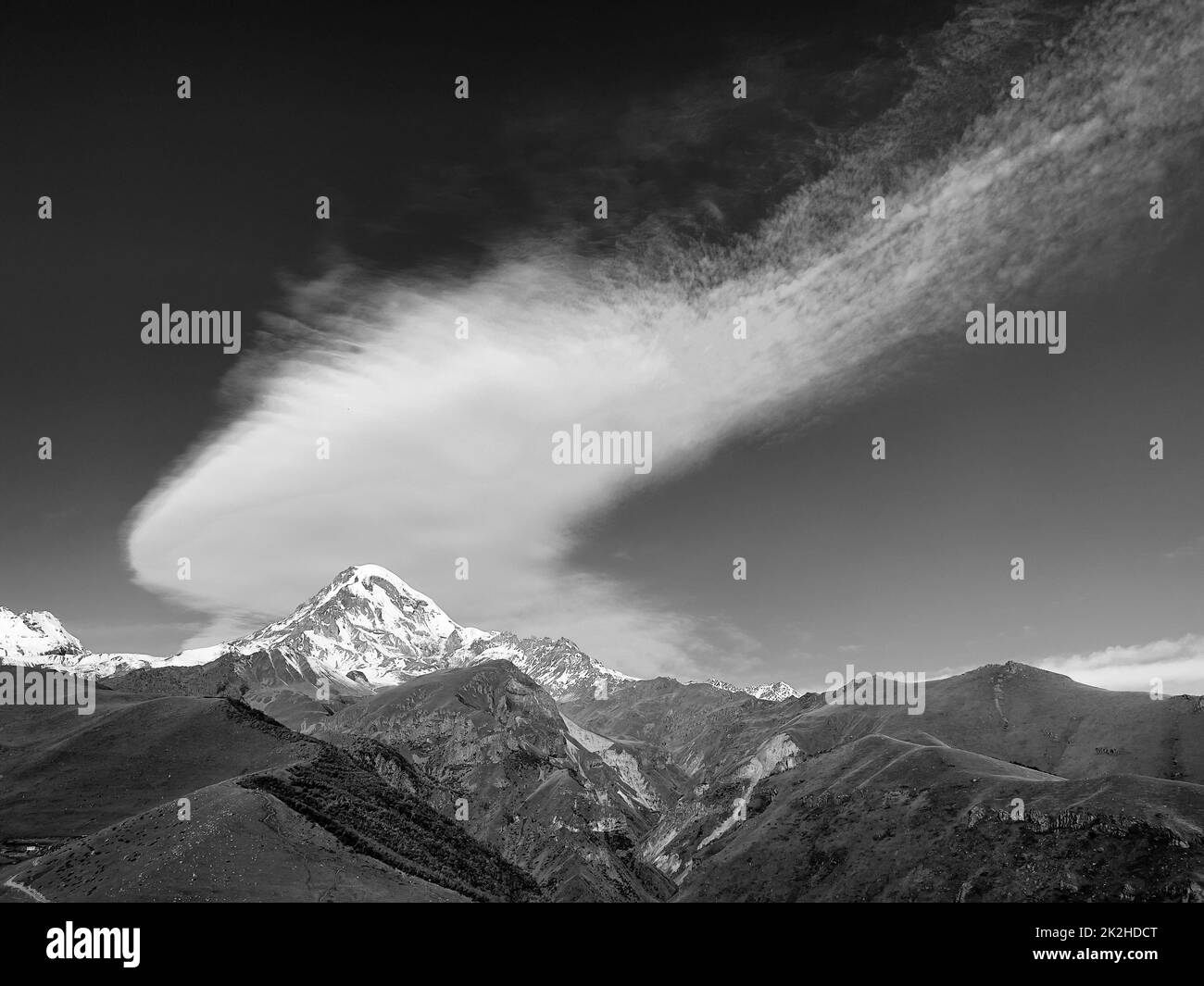 Mountain ridge with snowy peak Stock Photo - Alamy