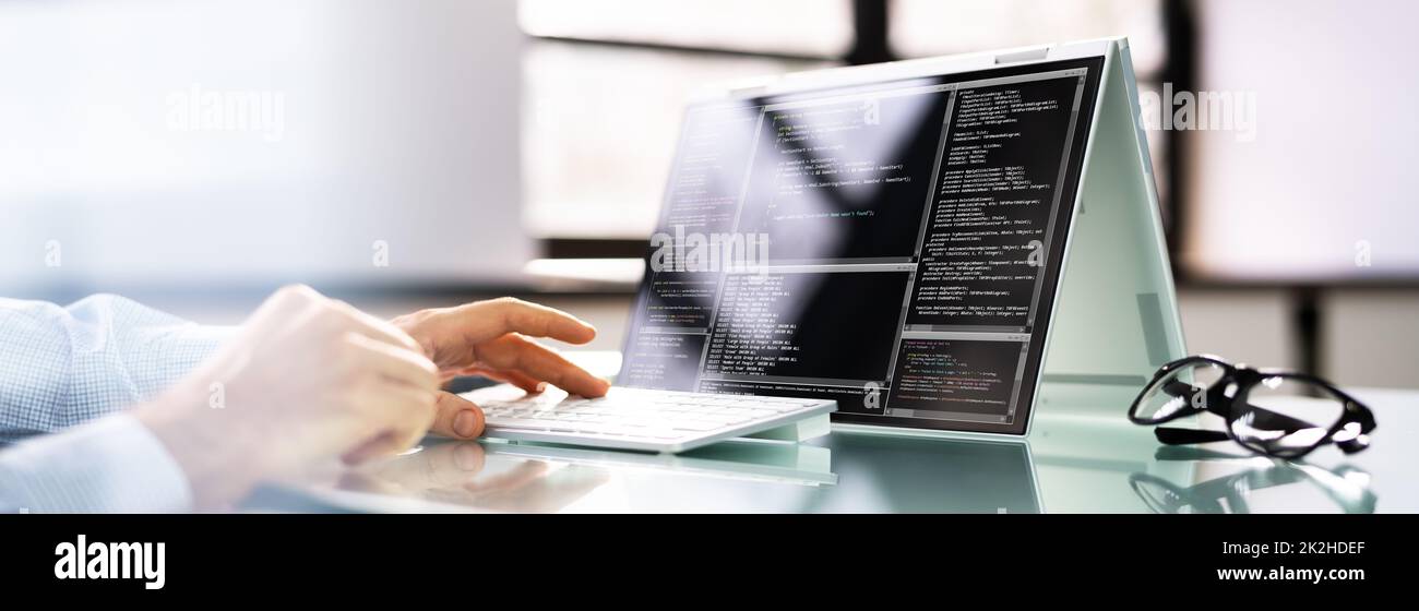 Programmer Or Coder At Office Desk Stock Photo - Alamy
