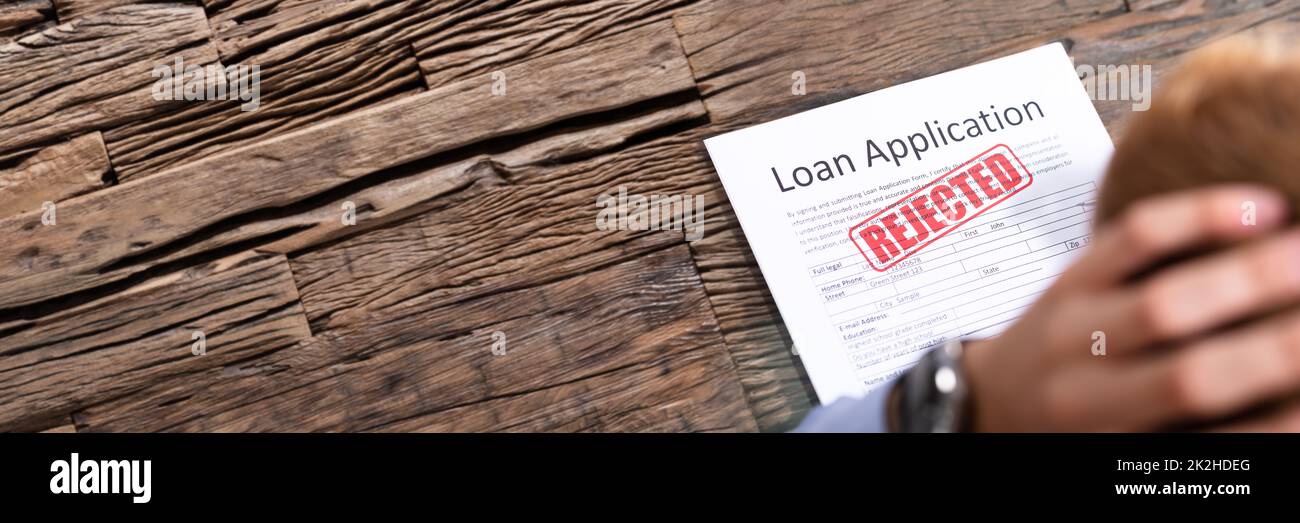 Person Looking At Rejected Loan Application Stock Photo - Alamy
