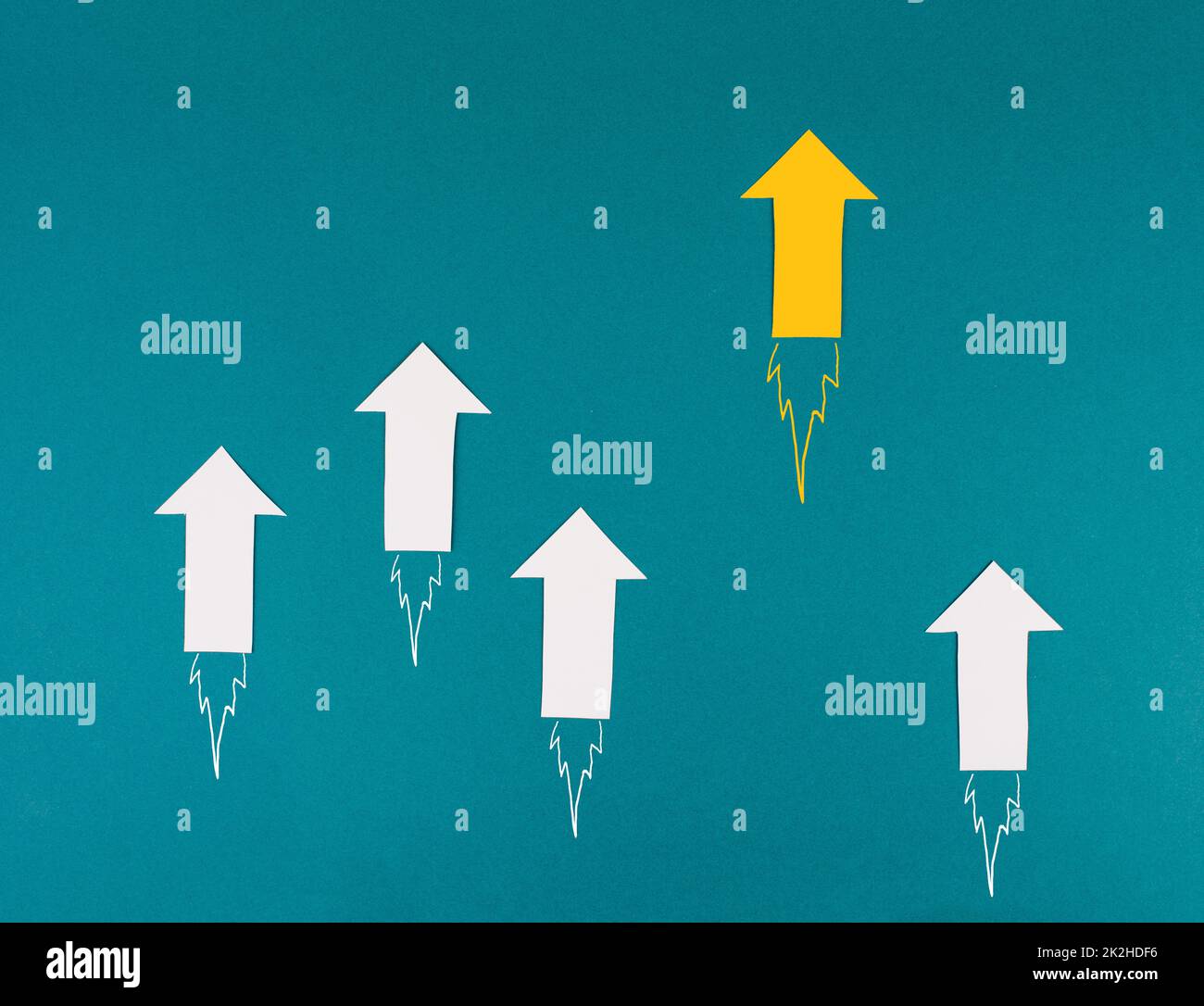 White arrows on a petrol background, one yellow is standing out, do ...