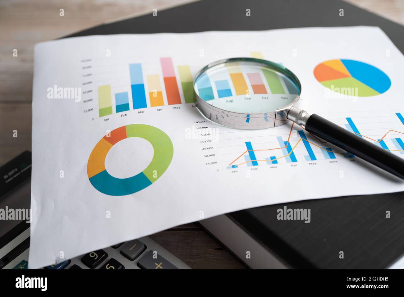 Magnifying glass on bar chart hi-res stock photography and images - Alamy