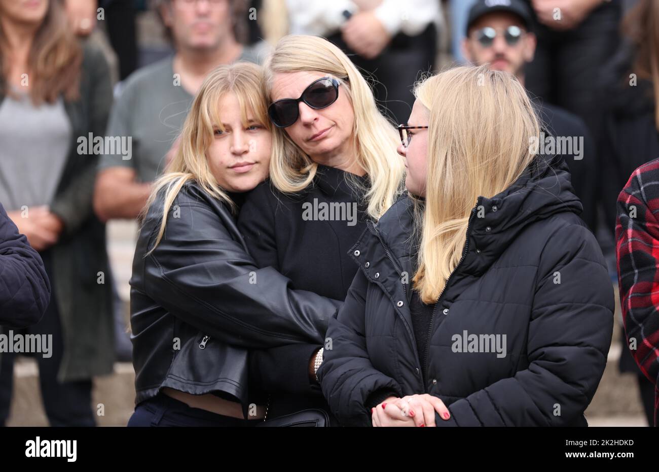 People fall silent at The Albert Memorial during the two minute silence ...