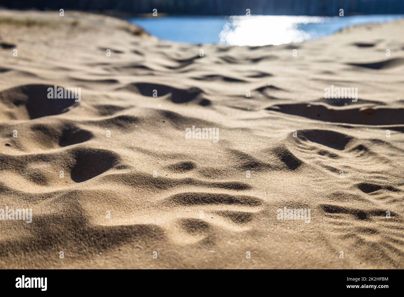 Sand at the beach with a human footprint steps Stock Photo - Alamy