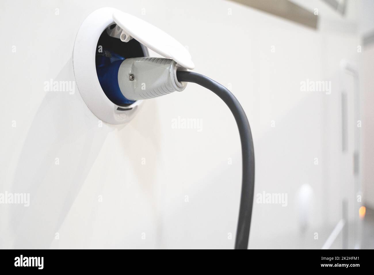closeup of motorhome electricity outlet attached to white RV campervan ...