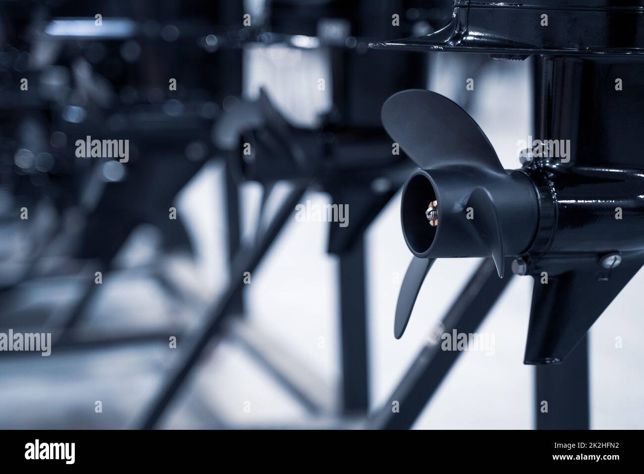 closeup of row of black boat ship propellers Stock Photo - Alamy