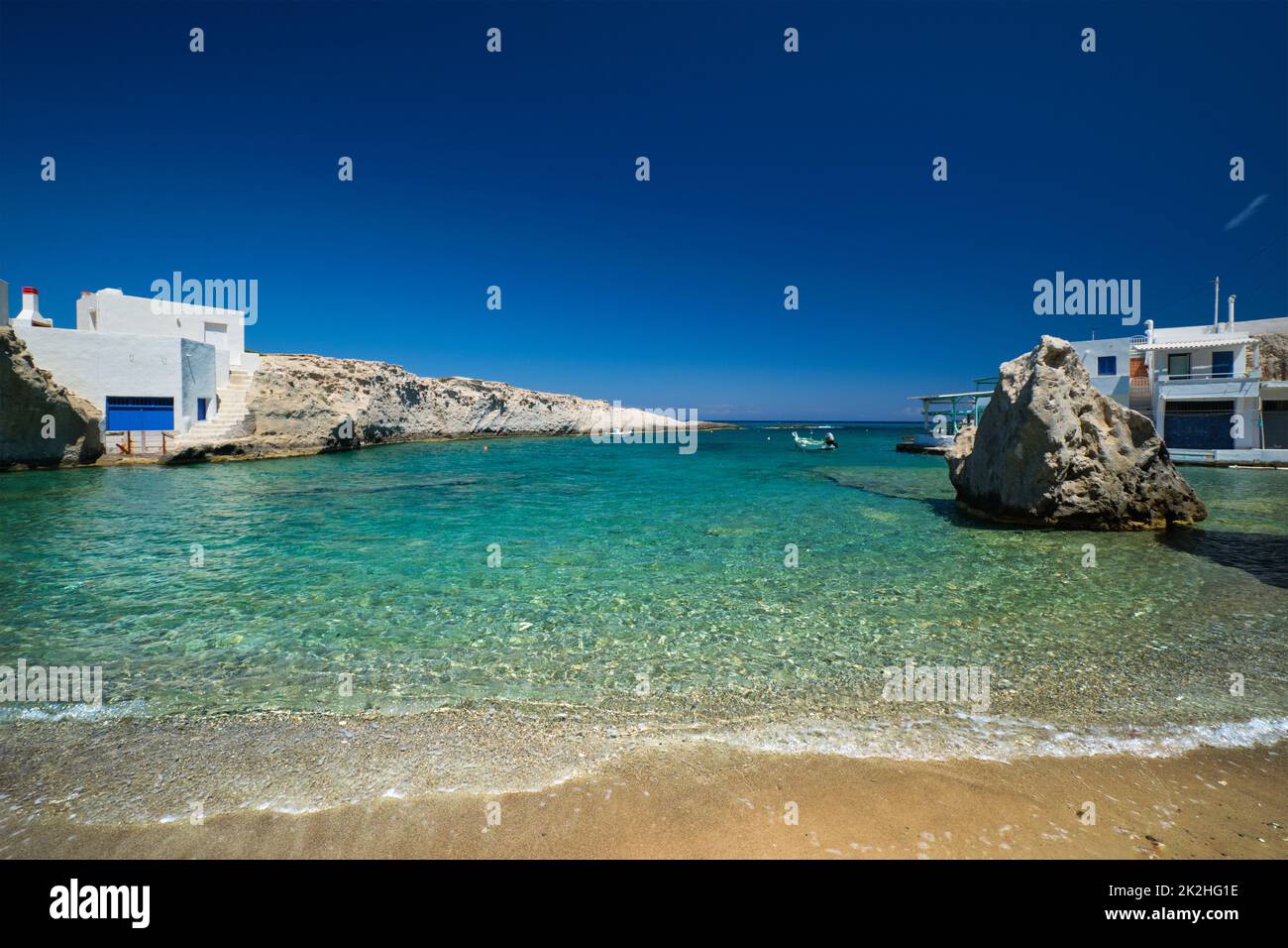 Crystal clear blue water at MItakas village beach, Milos island, Greece ...
