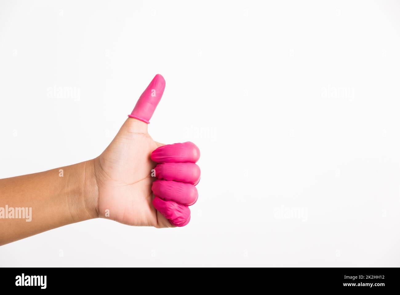 Woman hand wearing pink finger cots rubber protect Stock Photo - Alamy