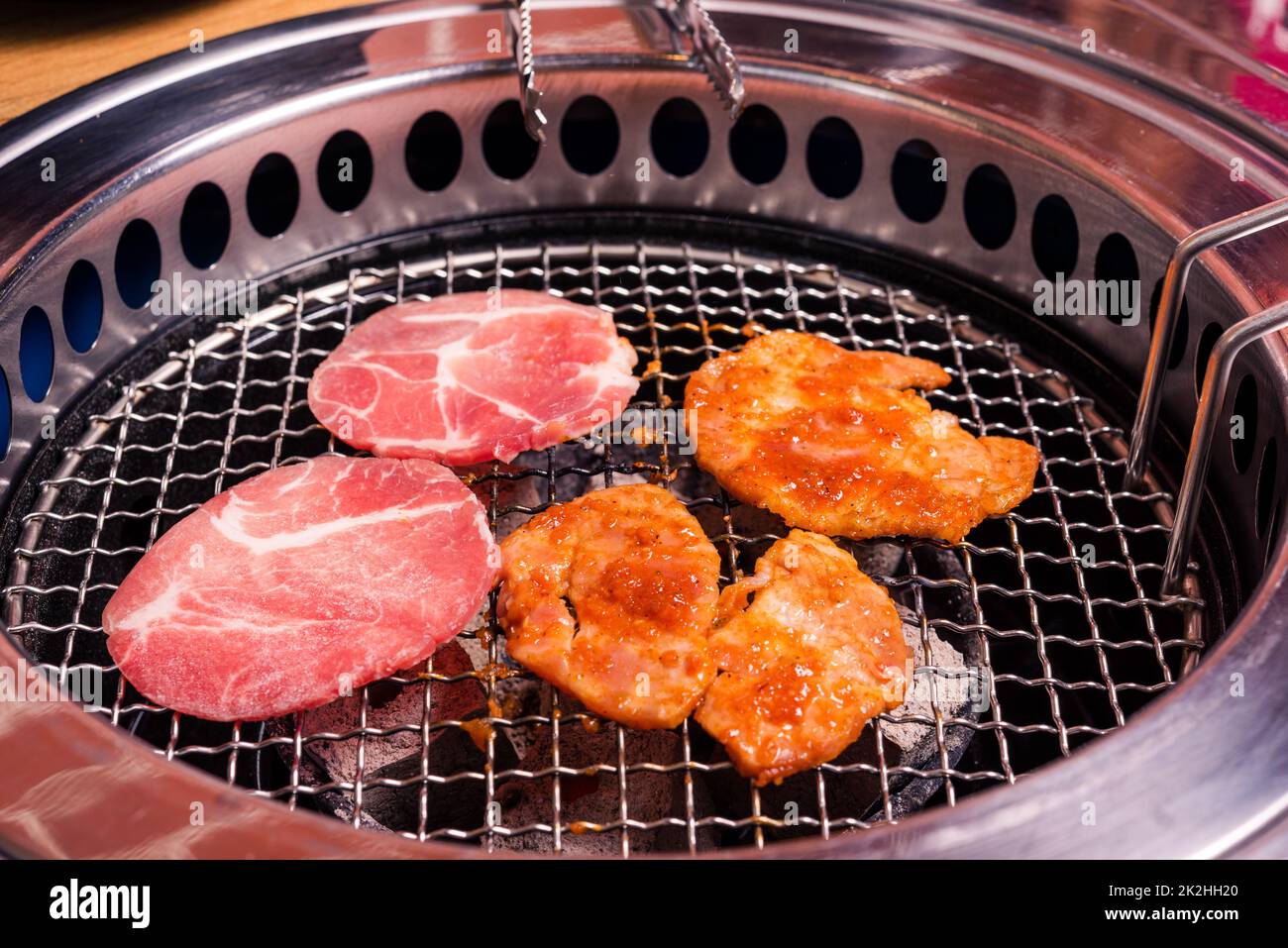 Grilling meat pork Korean BBQ traditional style on stove serve in ...