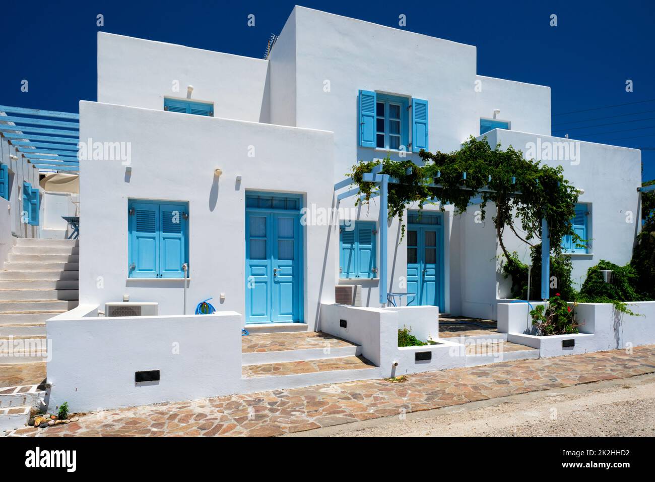 Traditional greek architecture houses painted white with blue doors and ...