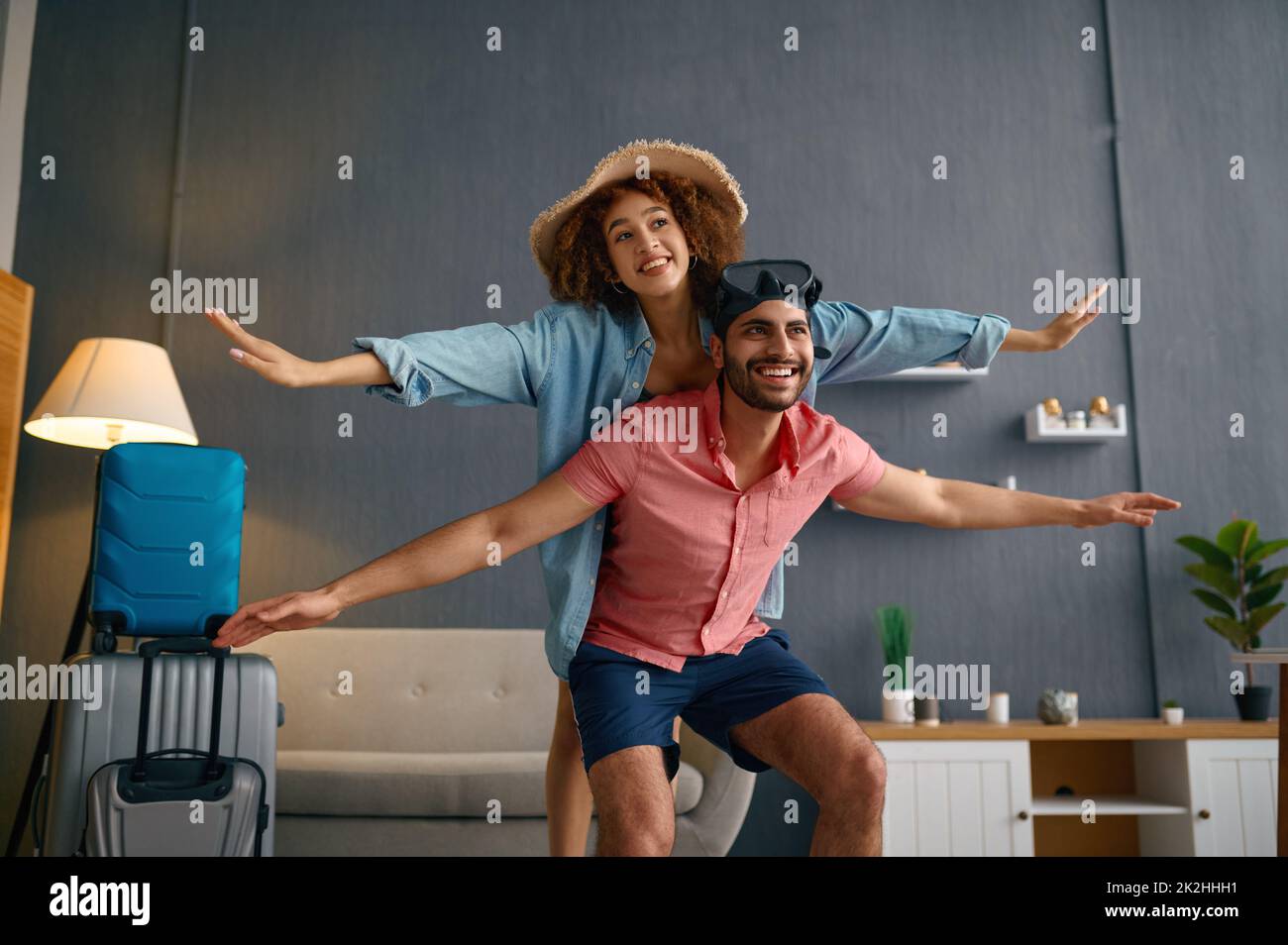 Happy couple having fun before honeymoon vacation Stock Photo - Alamy